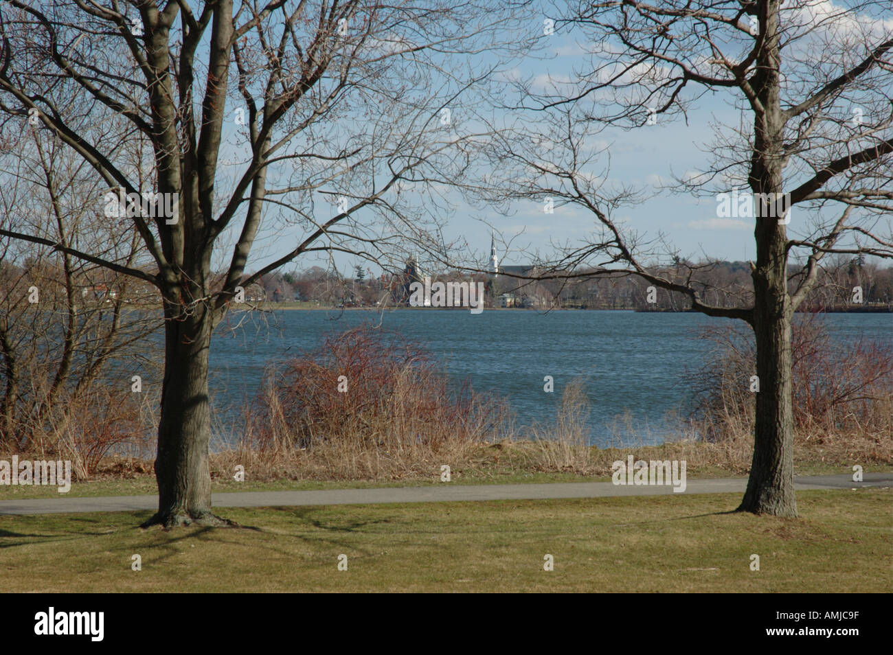 Trees framing church across lake Quannapowitt in Wakefield MA USA Stock ...