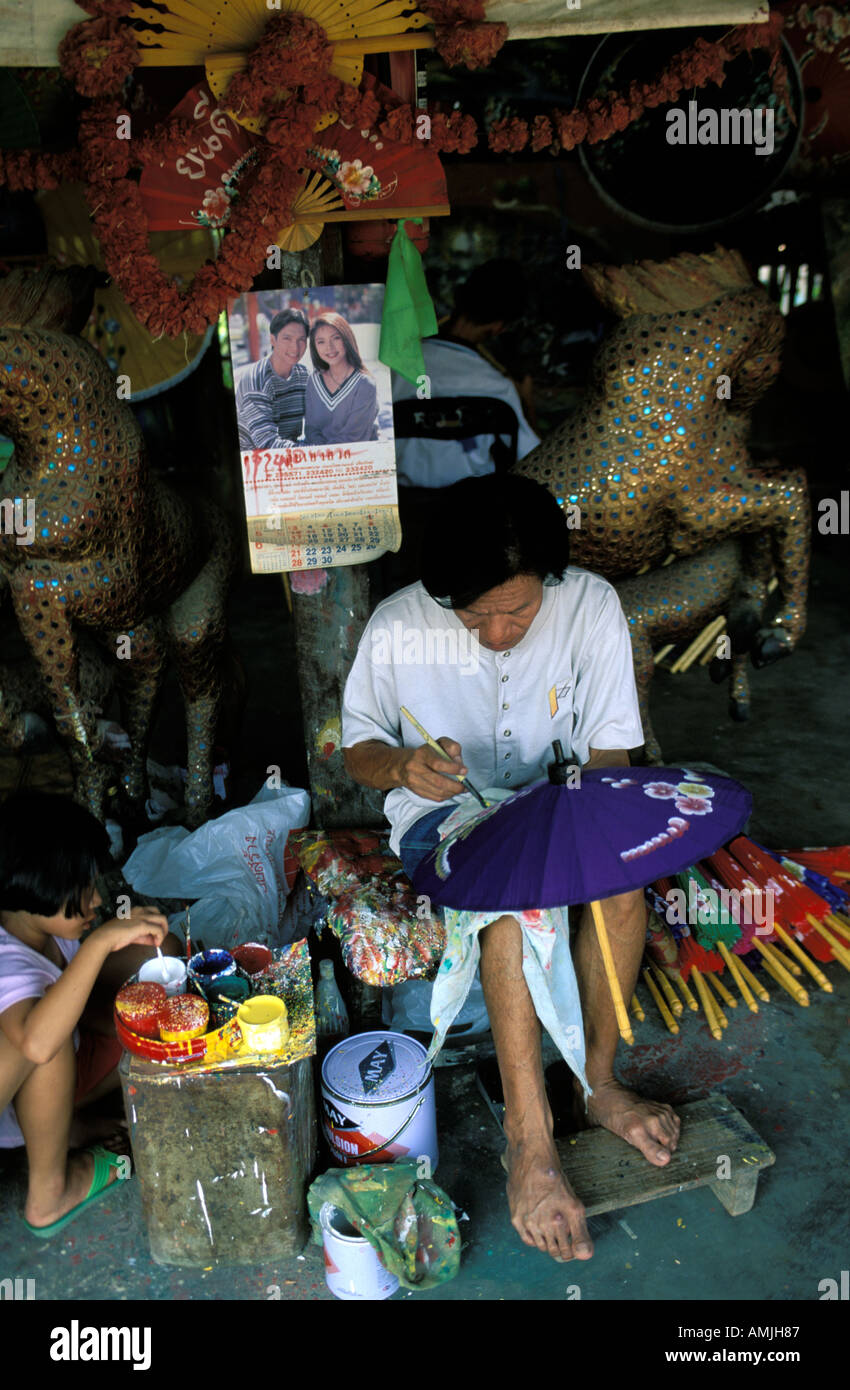Chiang mai A woman artist painting an umbrella Stock Photo - Alamy