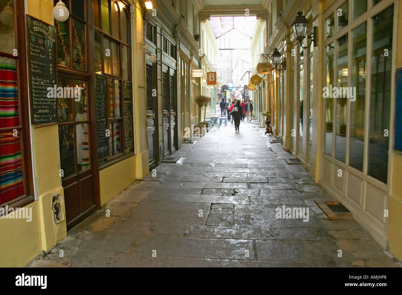 Alleyway of shops and restaurants Paris France Stock Photo - Alamy