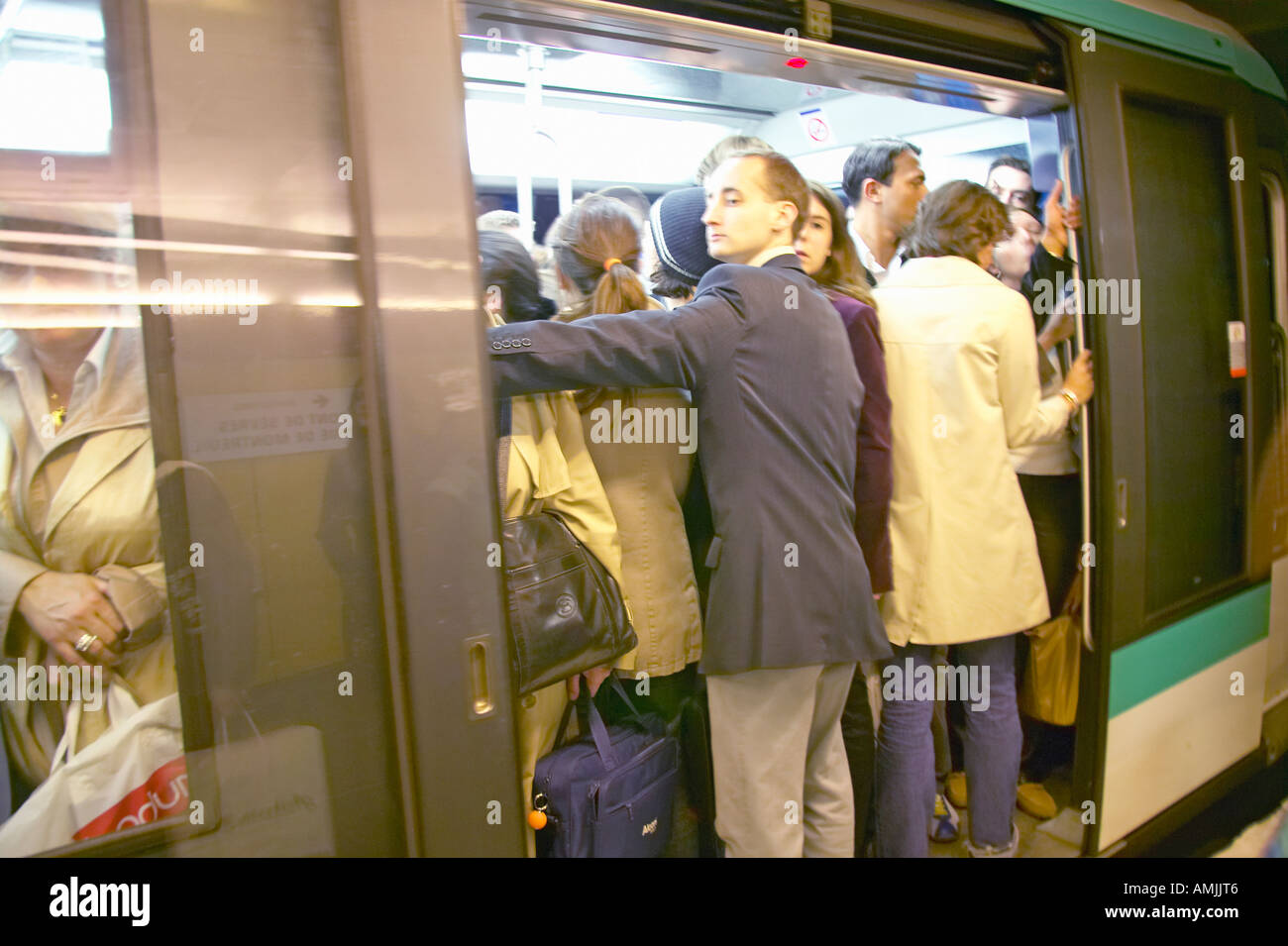 People crowding into metro train at rush hour Paris France Stock Photo ...