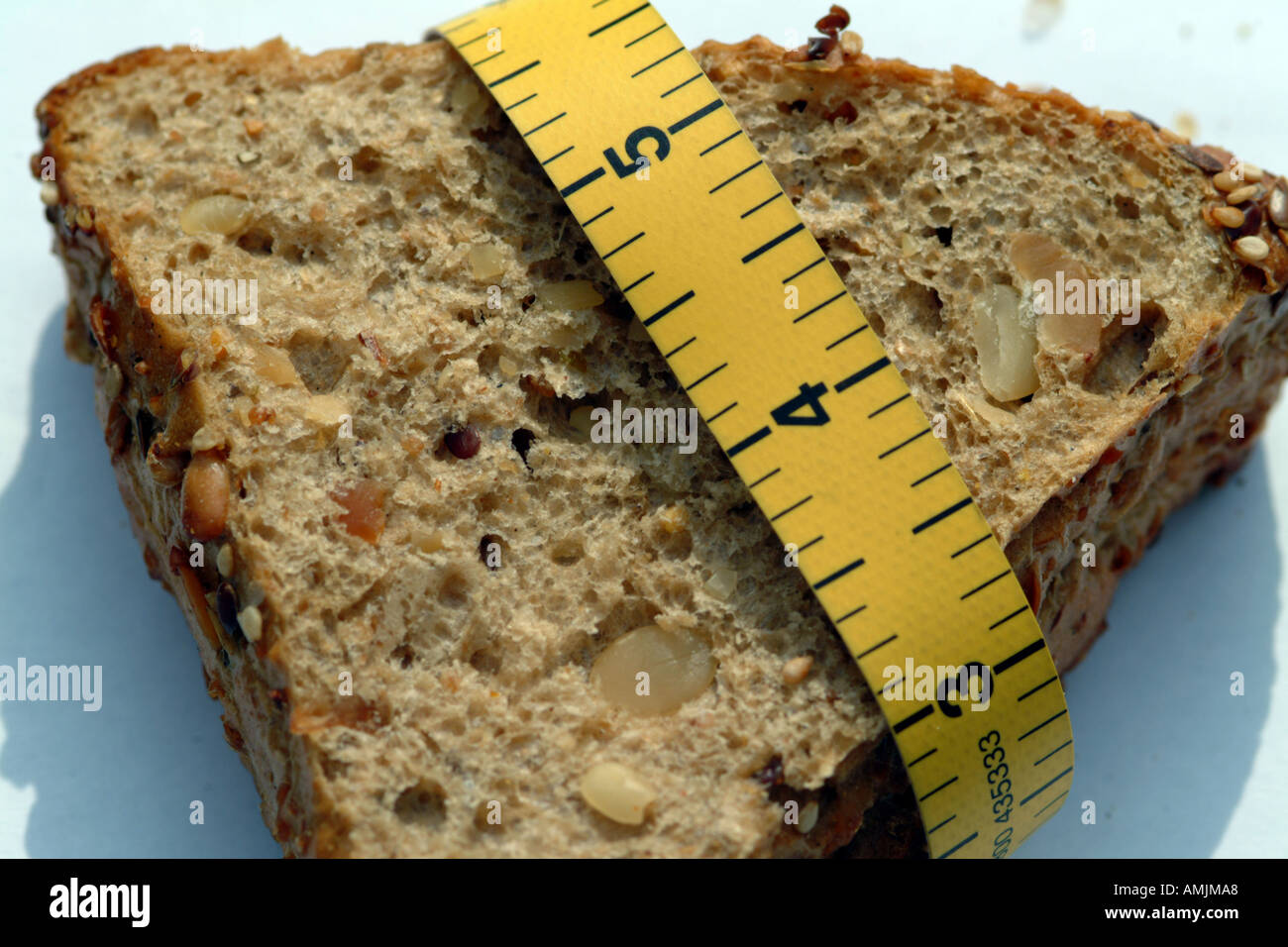 wholemeal bread with a tape measure around it Stock Photo - Alamy