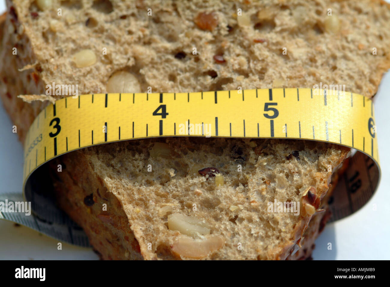 wholemeal bread with a tape measure around it Stock Photo - Alamy
