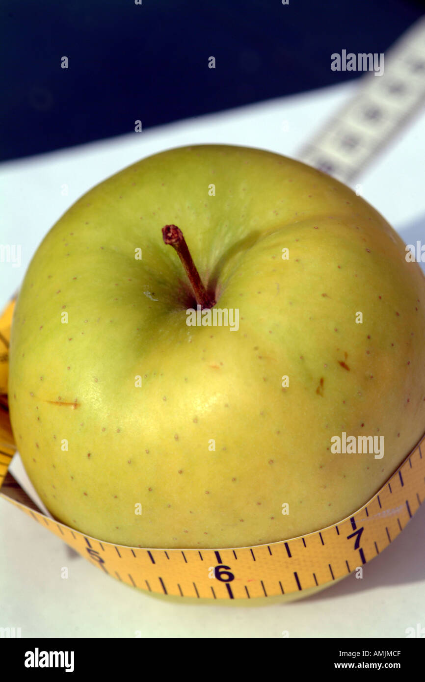 apple with tape measure around it Stock Photo - Alamy