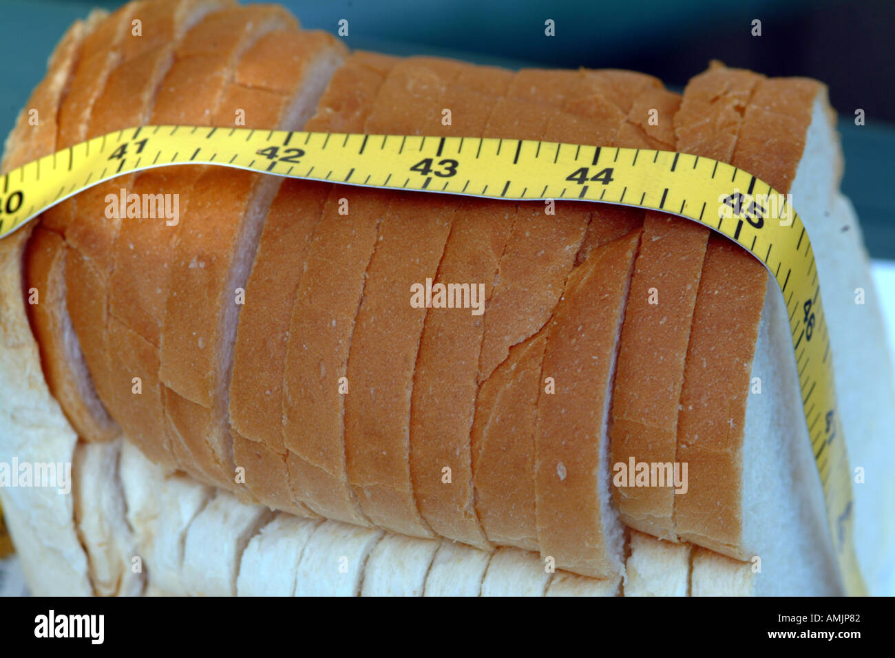 bread with a tape measure Stock Photo - Alamy