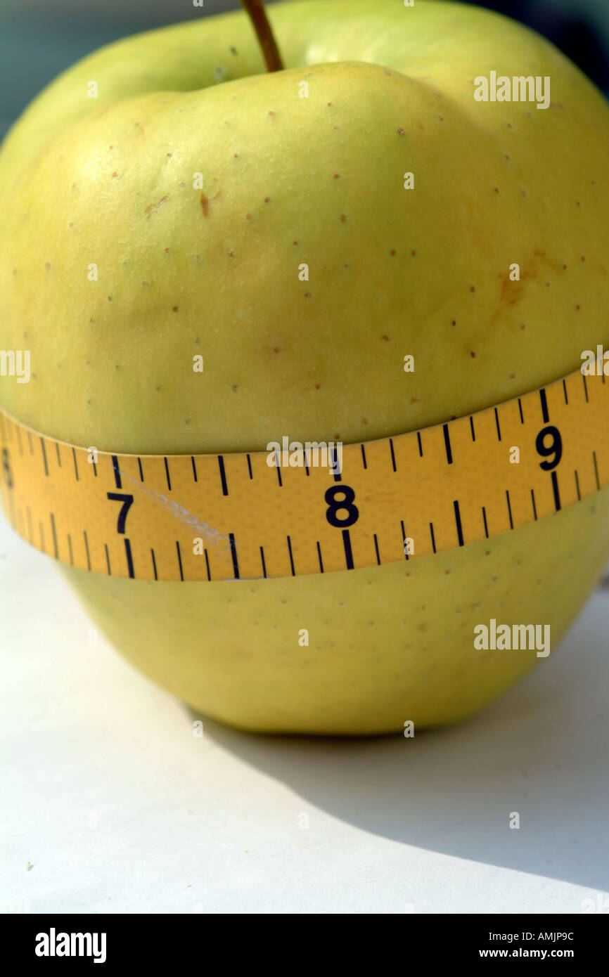 apple with a tape measure Stock Photo - Alamy