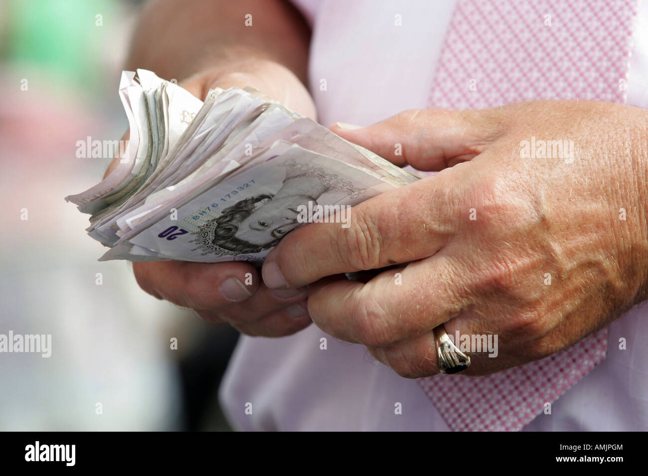 Man counting English pound notes Stock Photo - Alamy