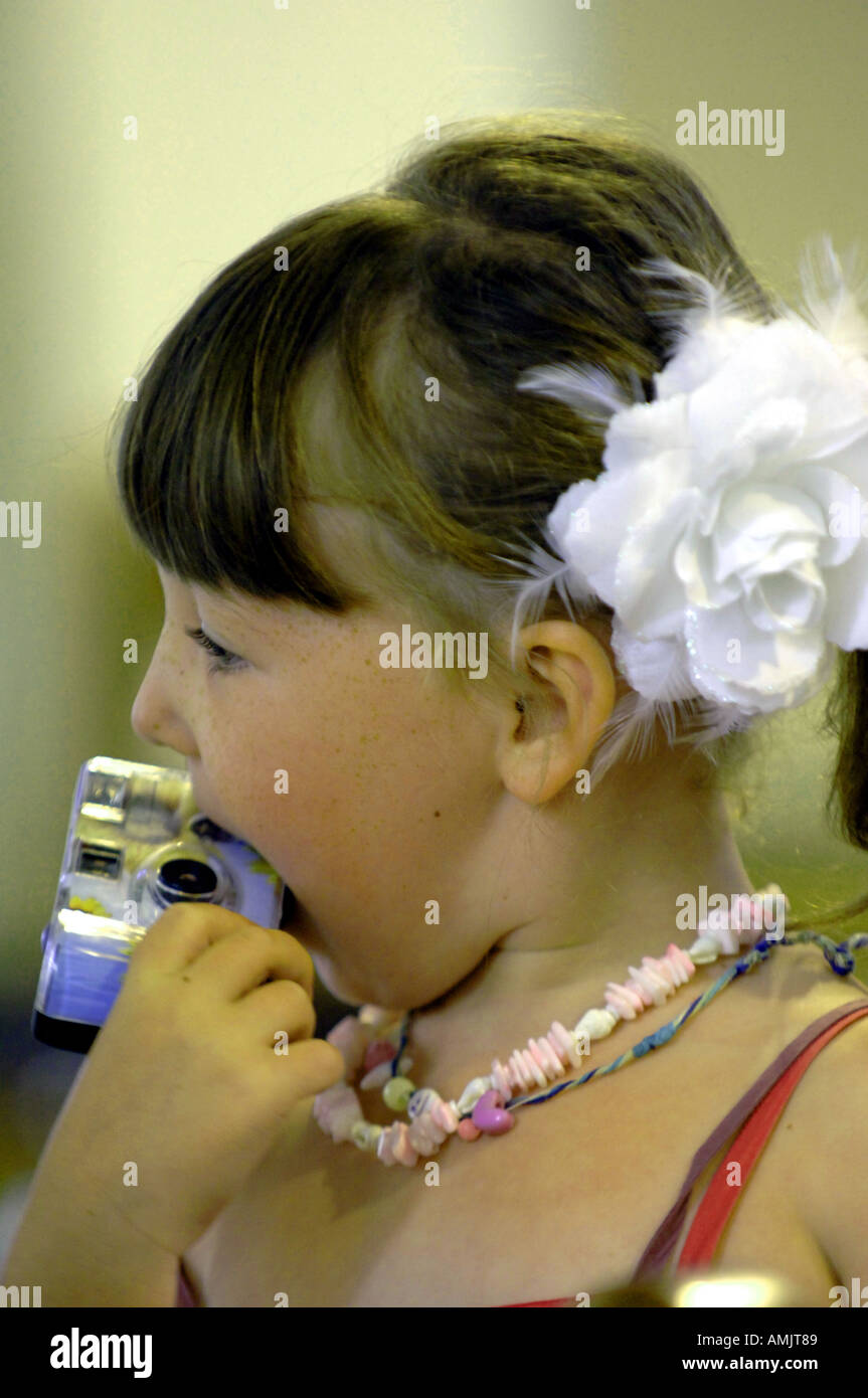 girl eating camera Stock Photo - Alamy