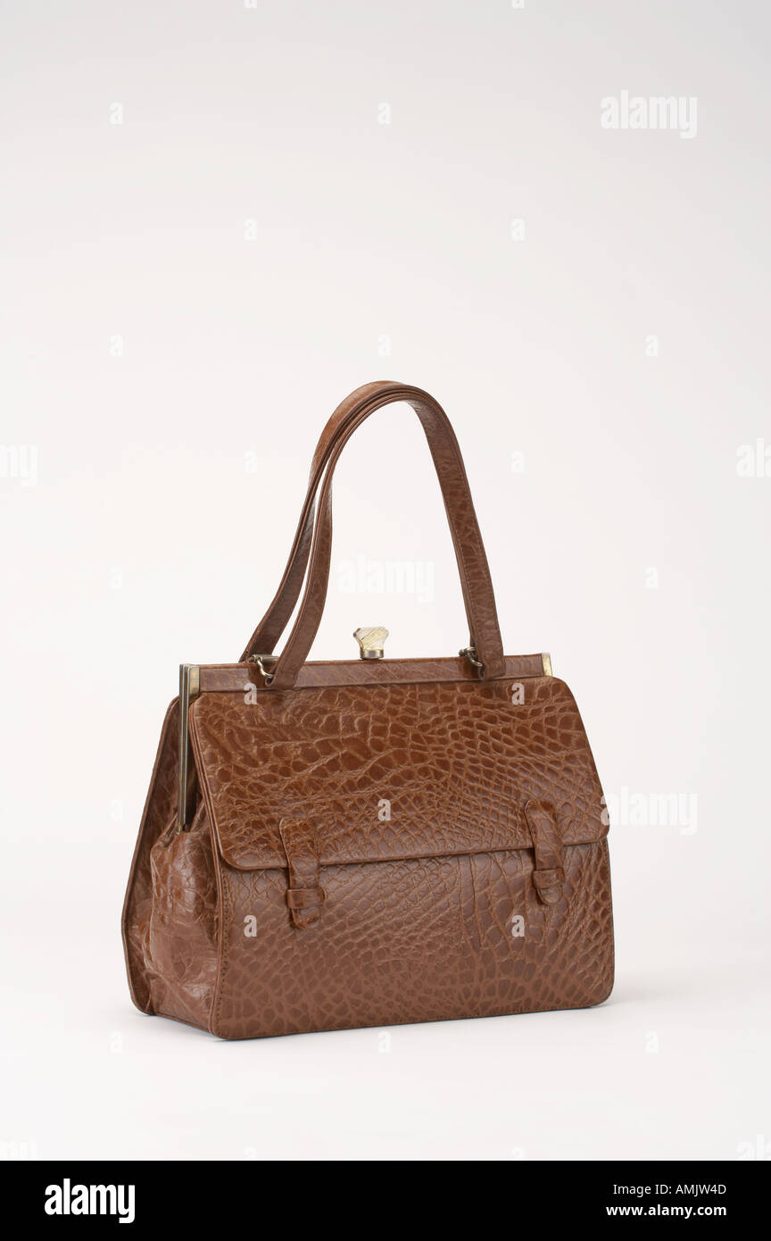 BROWN LADIES CROCODILE SKIN HANDBAG ON WHITE BACKGROUND Stock Photo - Alamy