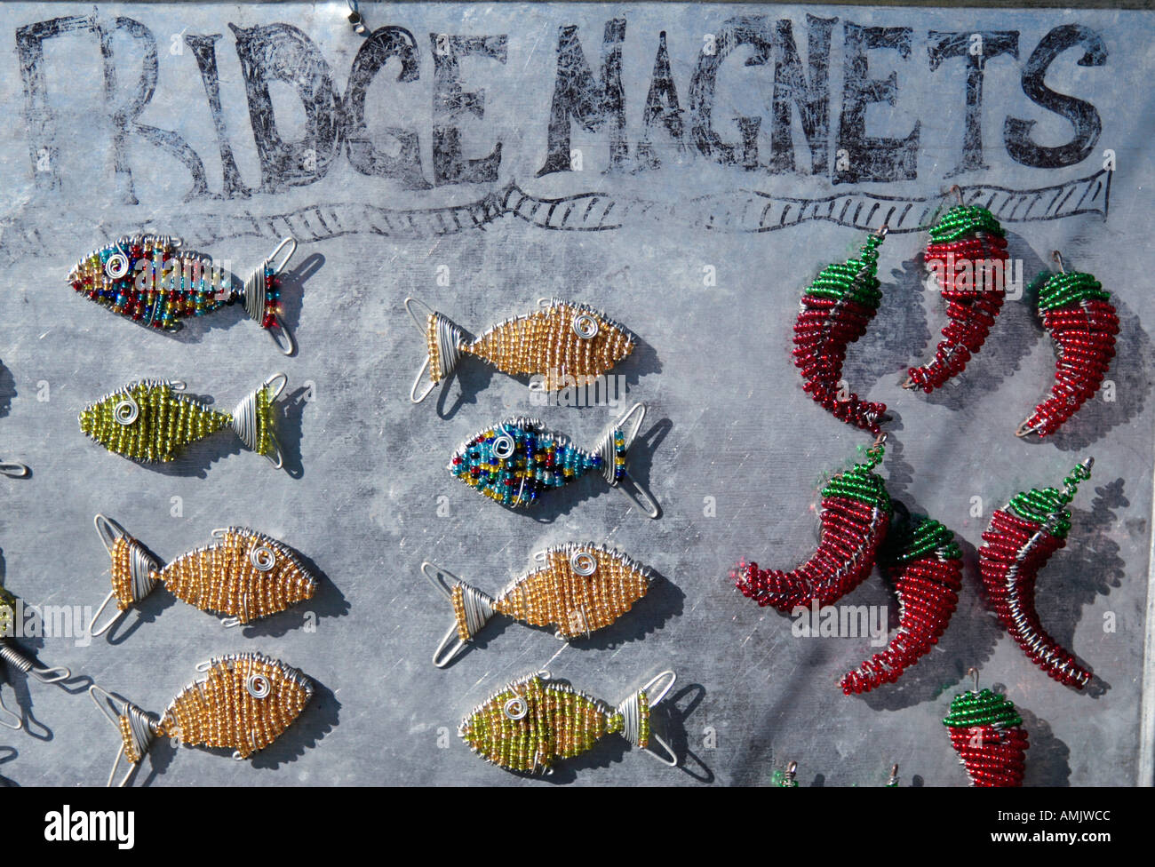 African beaded wire fish and chilli peppers Stock Photo - Alamy