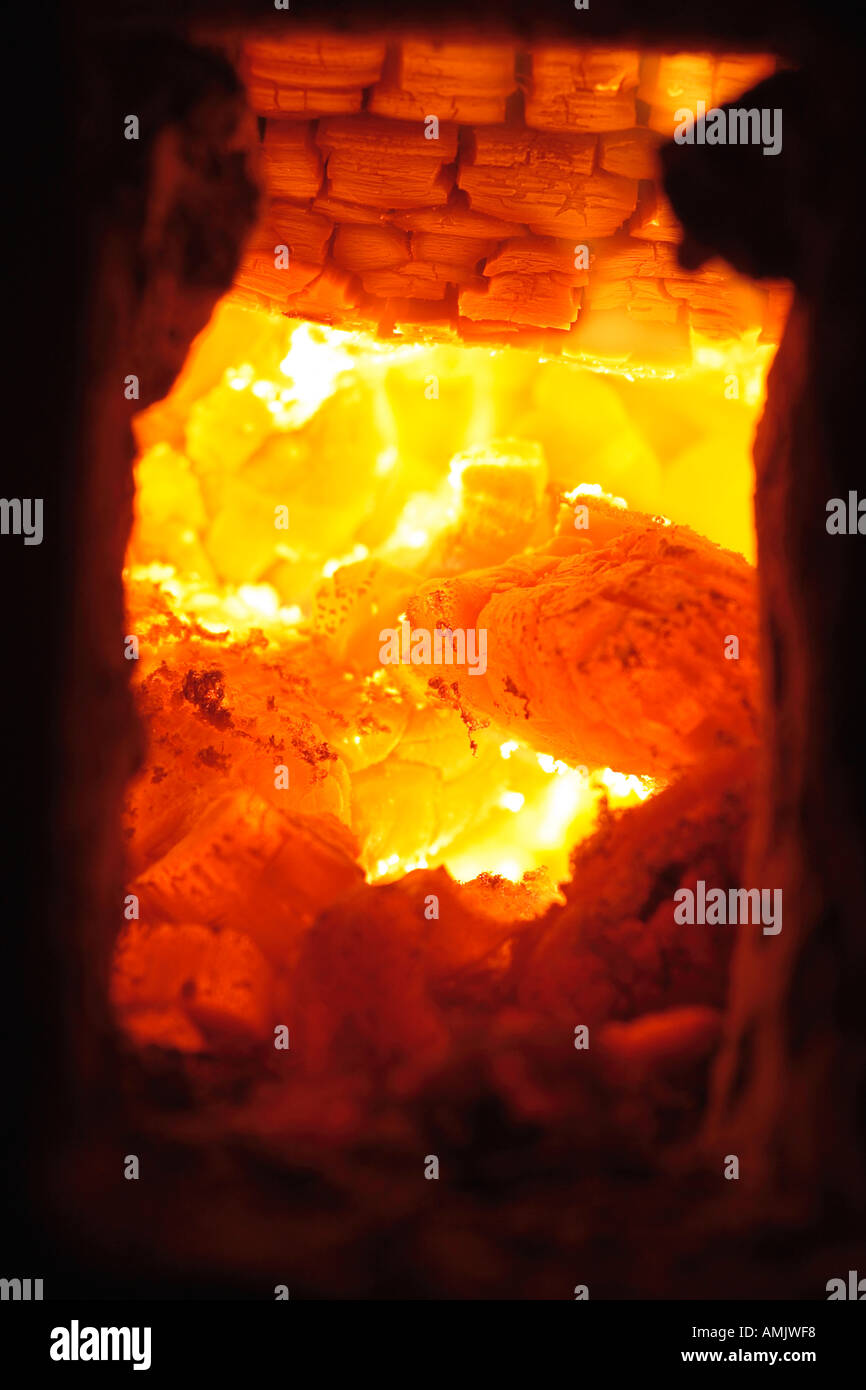 Vertical close up of logs wood burning in fire Stock Photo - Alamy