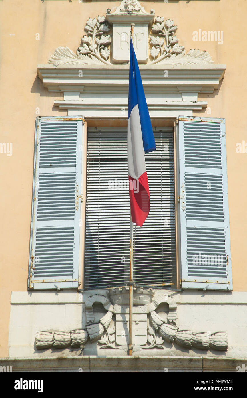 French flag flying from window Antibes France Stock Photo - Alamy