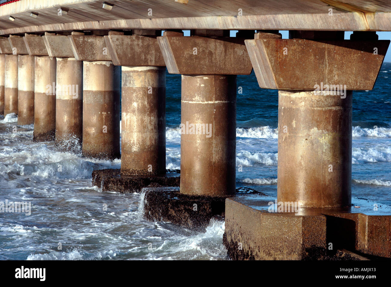 Close up of pillars of pier over water Stock Photo - Alamy
