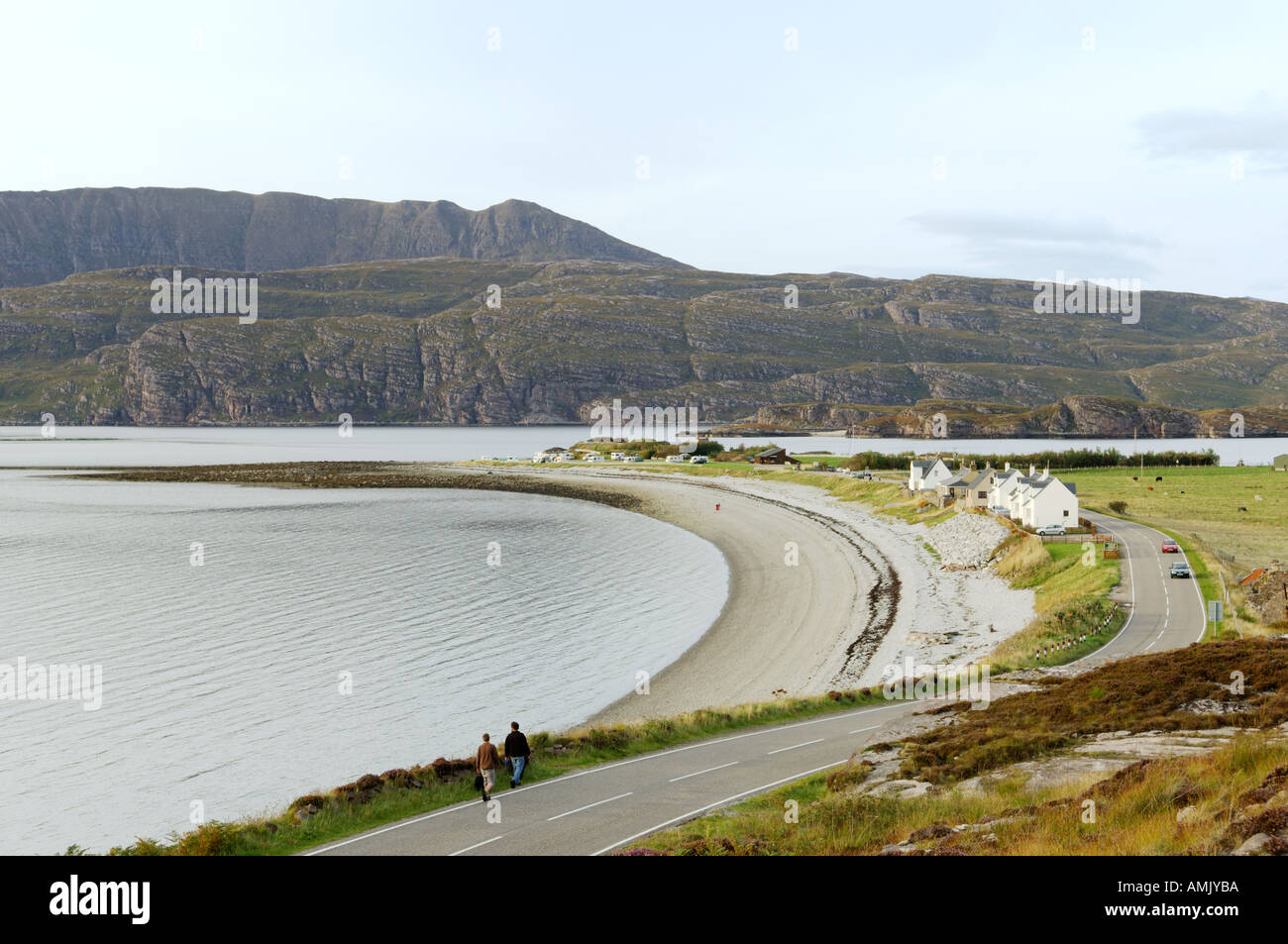 Ardmair village near Ullapool, Wester Ross, Scotland. Couple walking ...