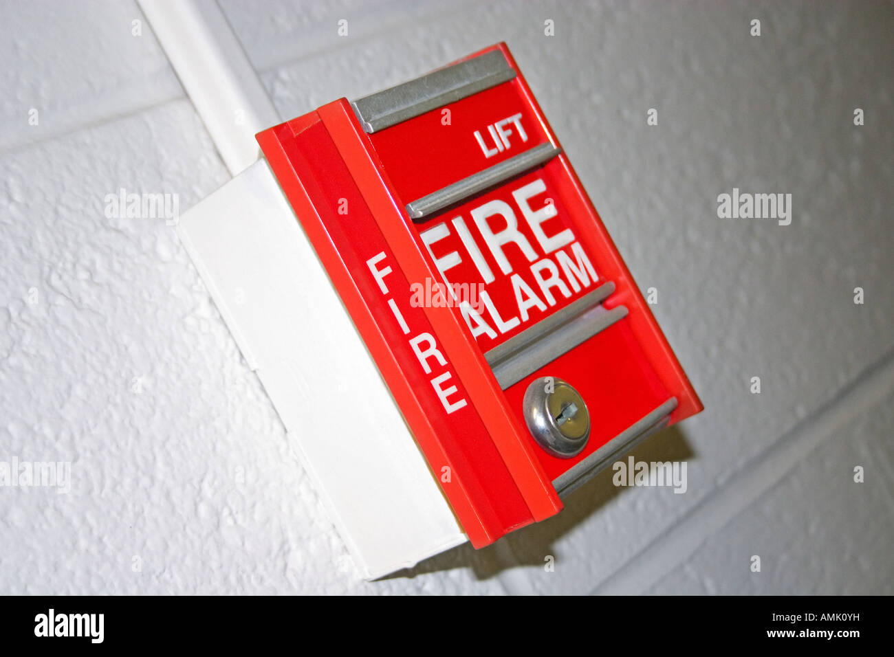 Red Fire Alarm box on a white wall Stock Photo - Alamy