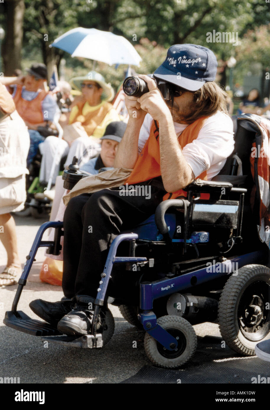 Man with a disability who utilizes a wheelchair for mobility taking ...