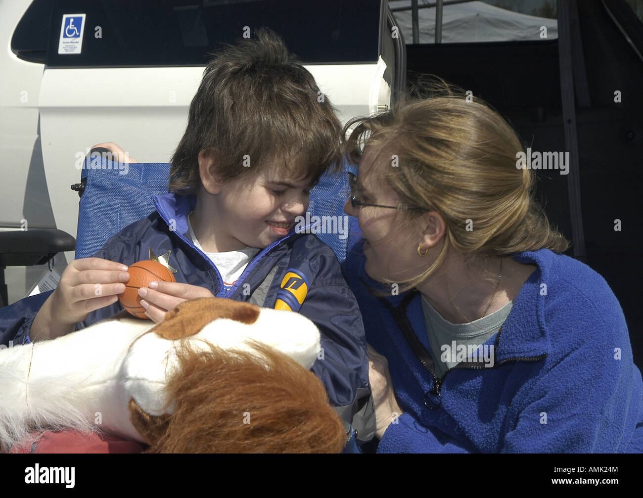 Boy with autism and Mom sharing a laugh Stock Photo - Alamy