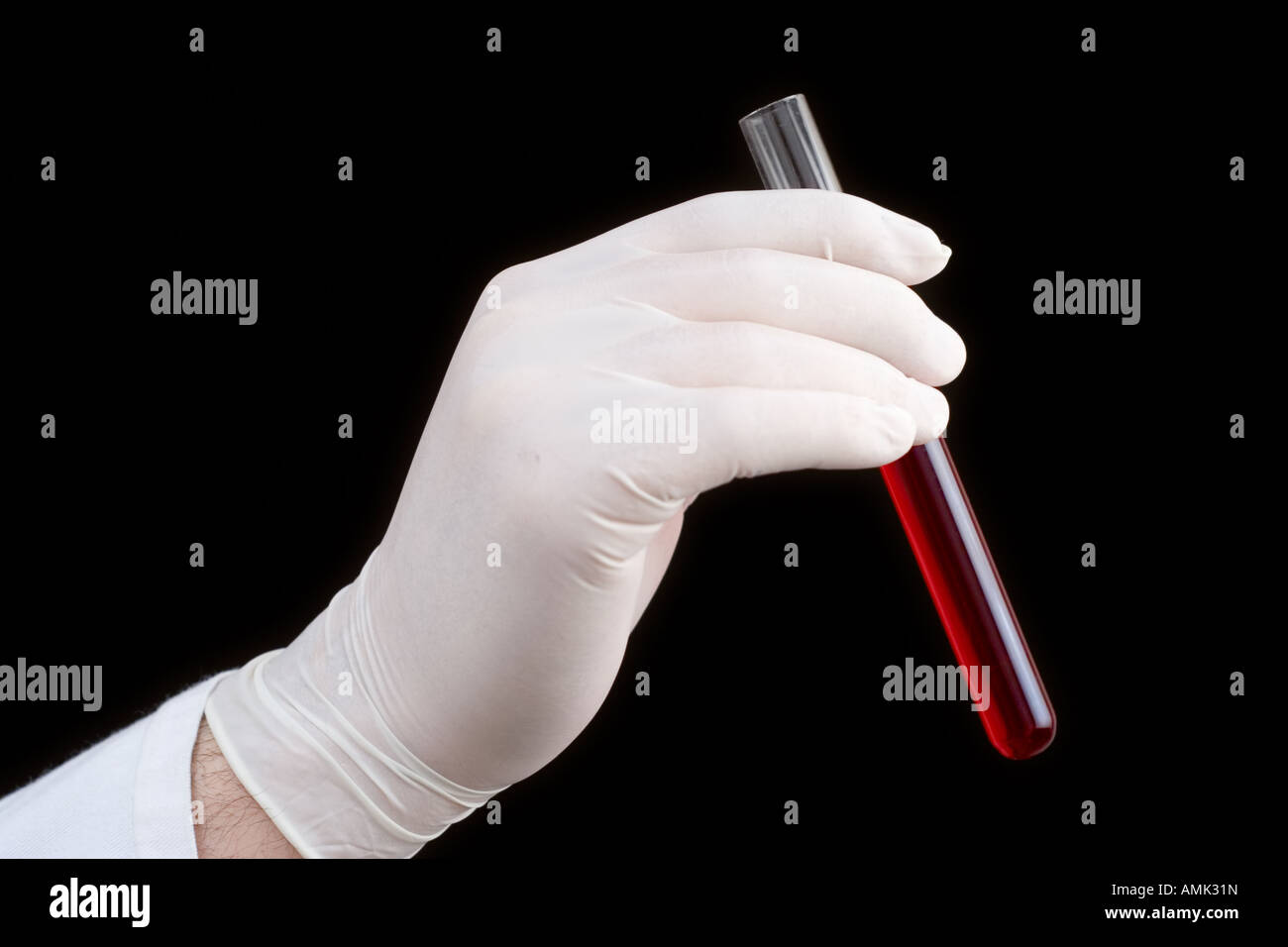 Lab worker holding a test tube Stock Photo - Alamy