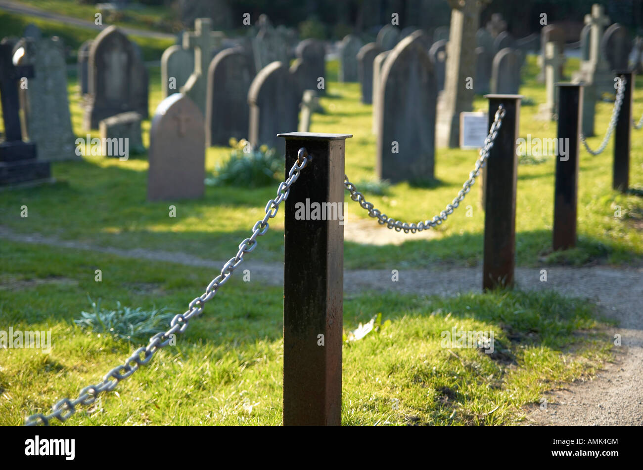 Chain link fence in graveyard Stock Photo - Alamy