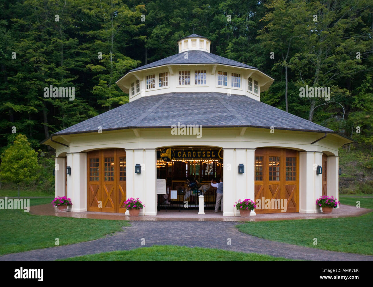 Carousel at an amusement area Stock Photo - Alamy