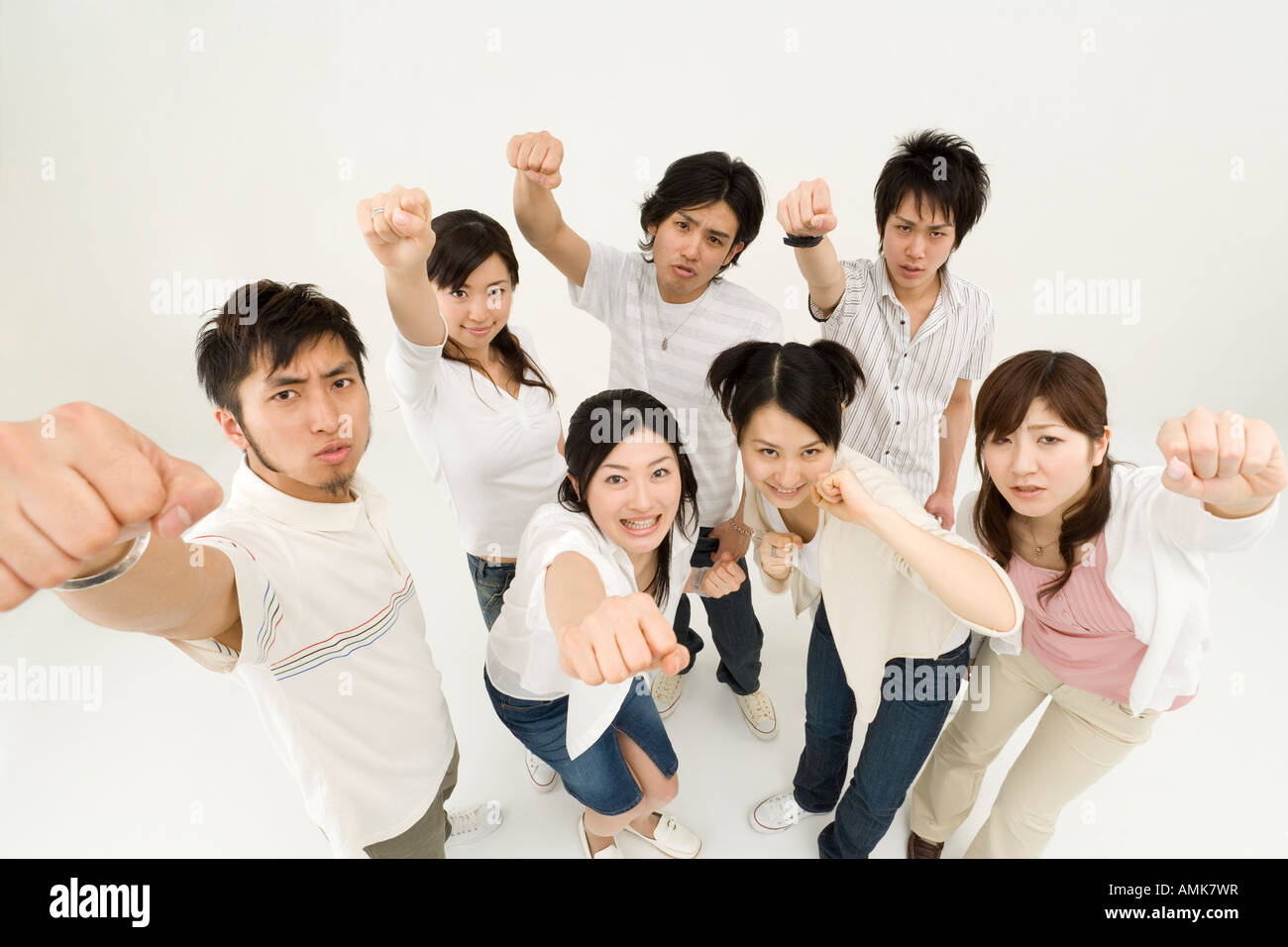 Young people raising hands Stock Photo - Alamy
