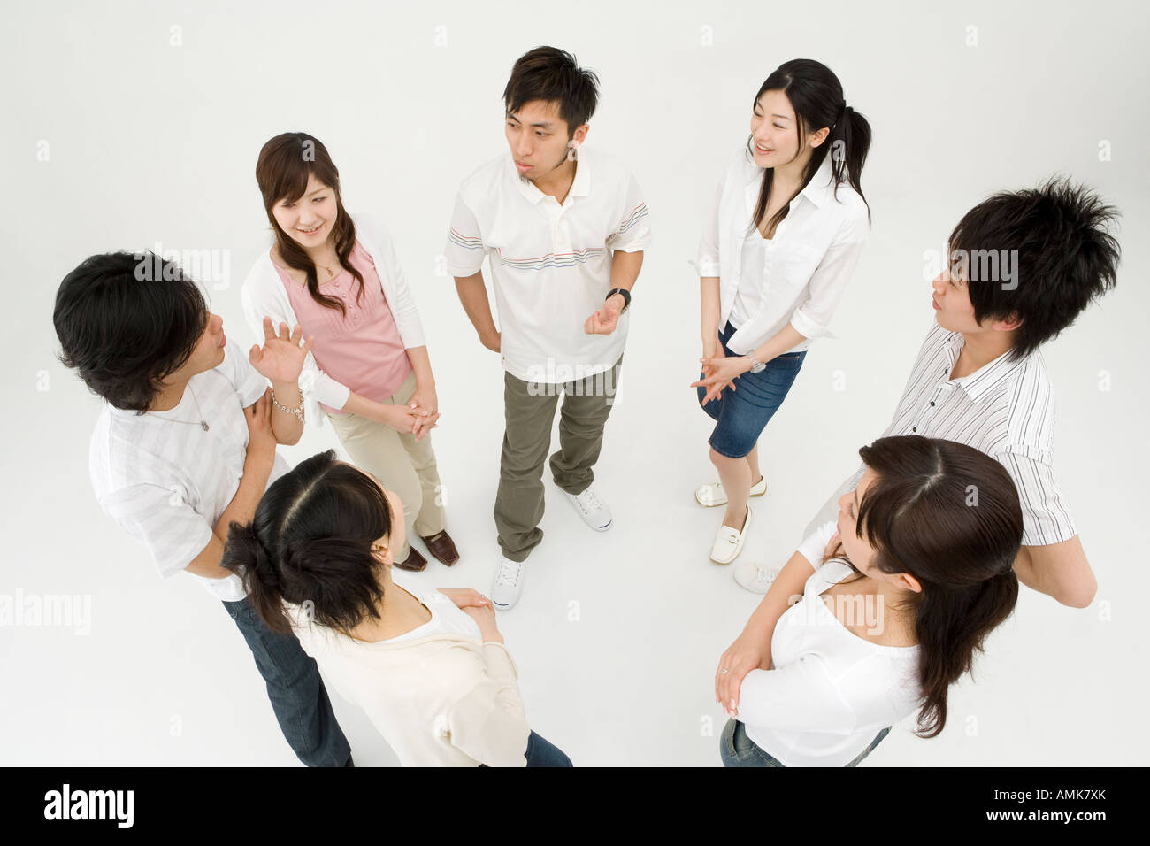 Young people standing in circle Stock Photo - Alamy