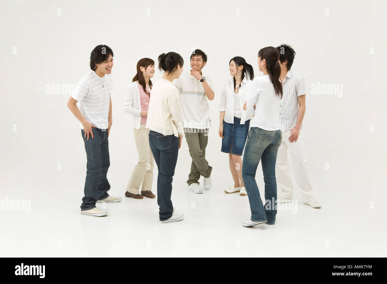 Young people standing in circle Stock Photo - Alamy