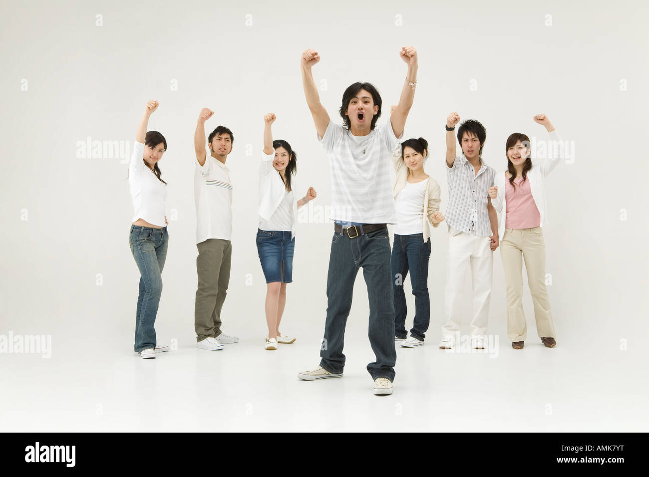 Young people raising hands Stock Photo - Alamy