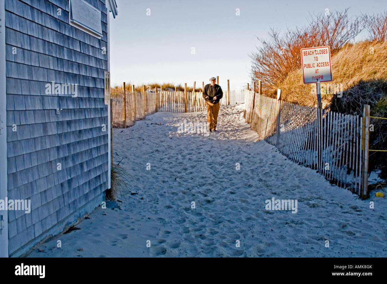A lone senior man walking from the beach in Cape Cod Stock Photo - Alamy