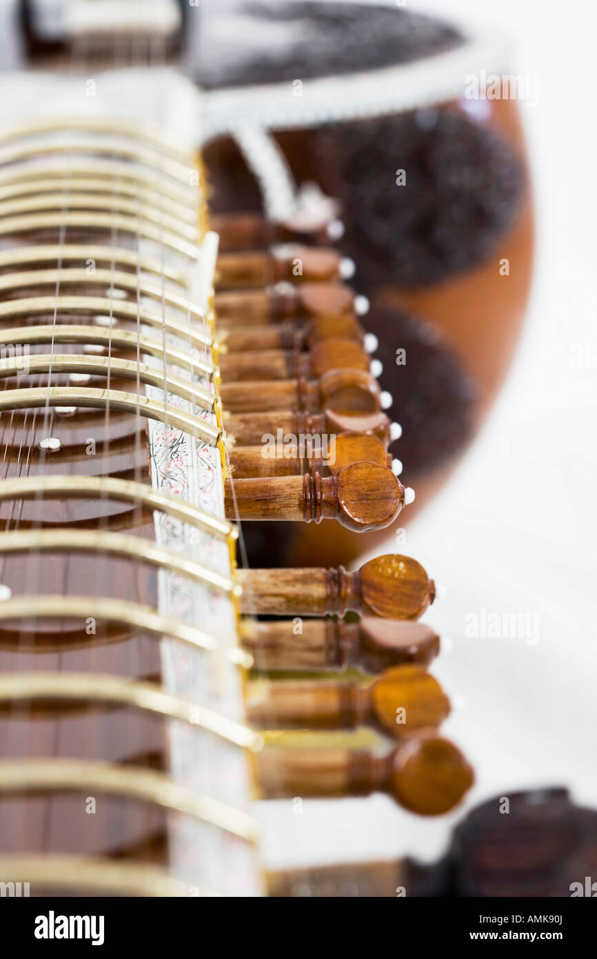 Indian sitar on white background Stock Photo - Alamy