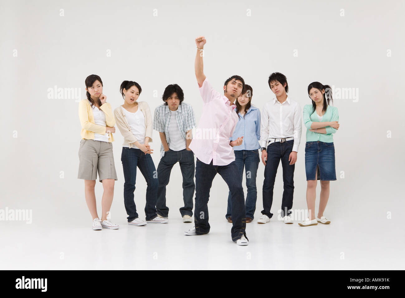 Young man raising his arm Stock Photo - Alamy