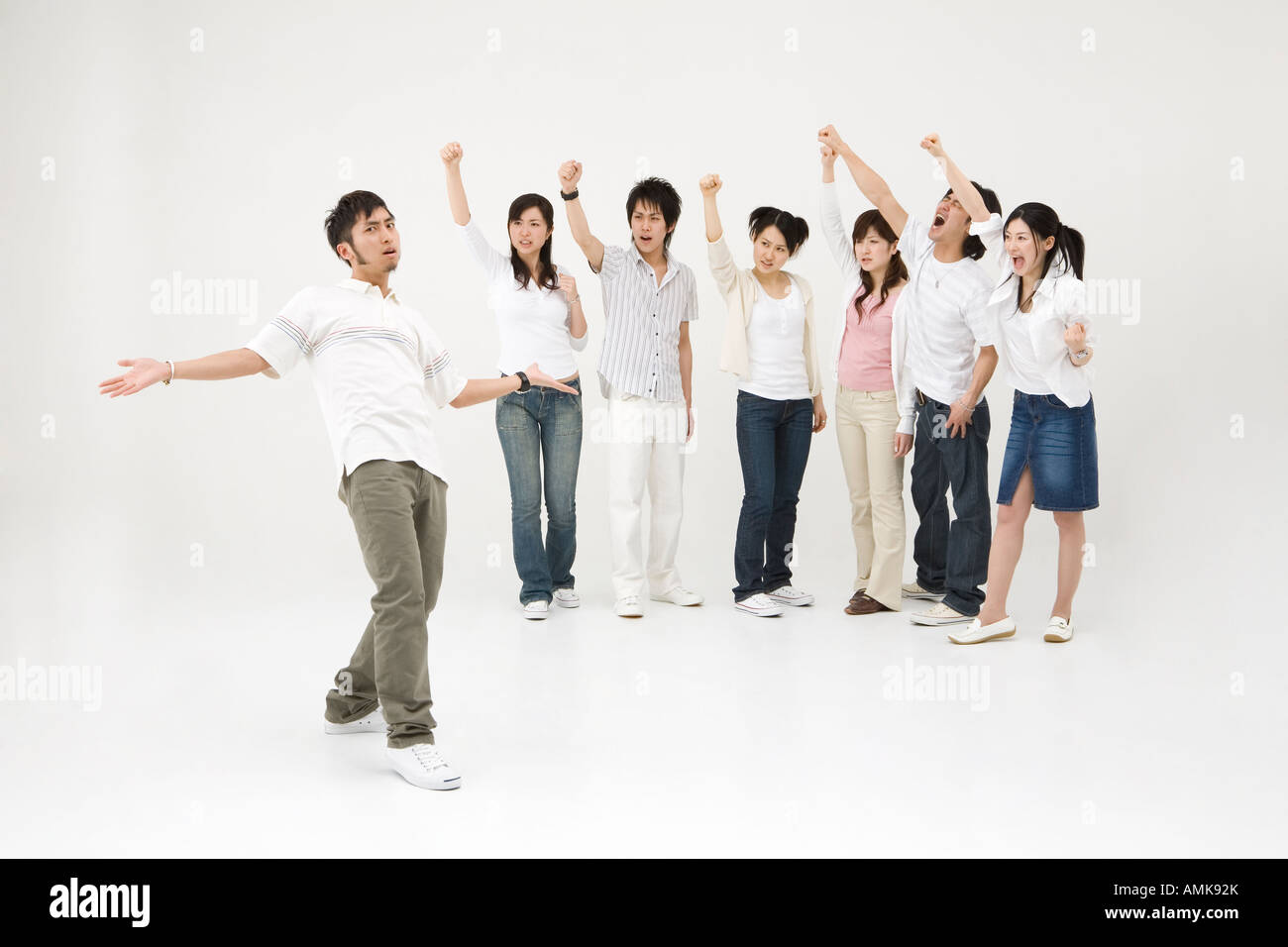 Group of people shouting at young man Stock Photo - Alamy