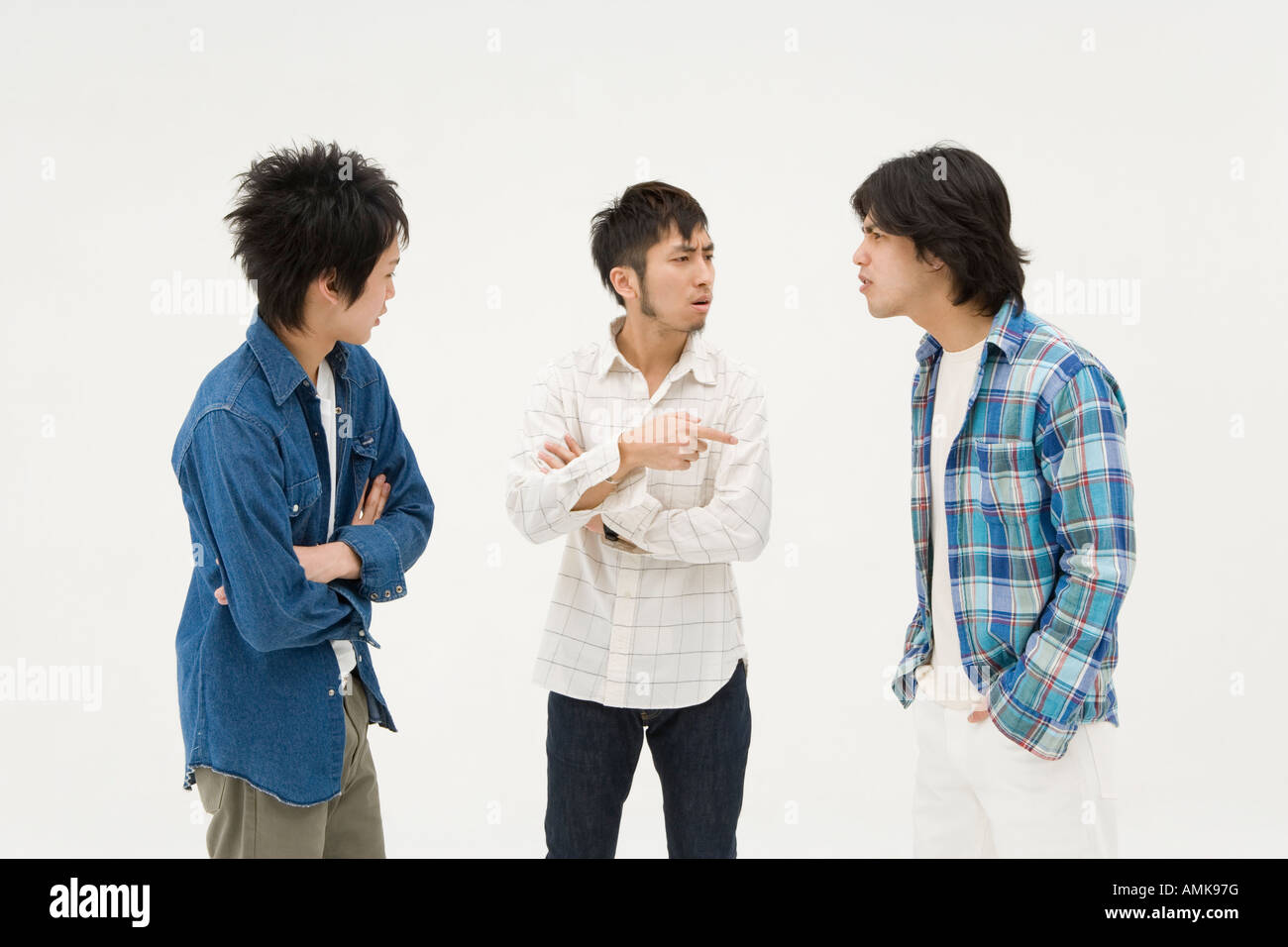 Three young men arguing Stock Photo - Alamy