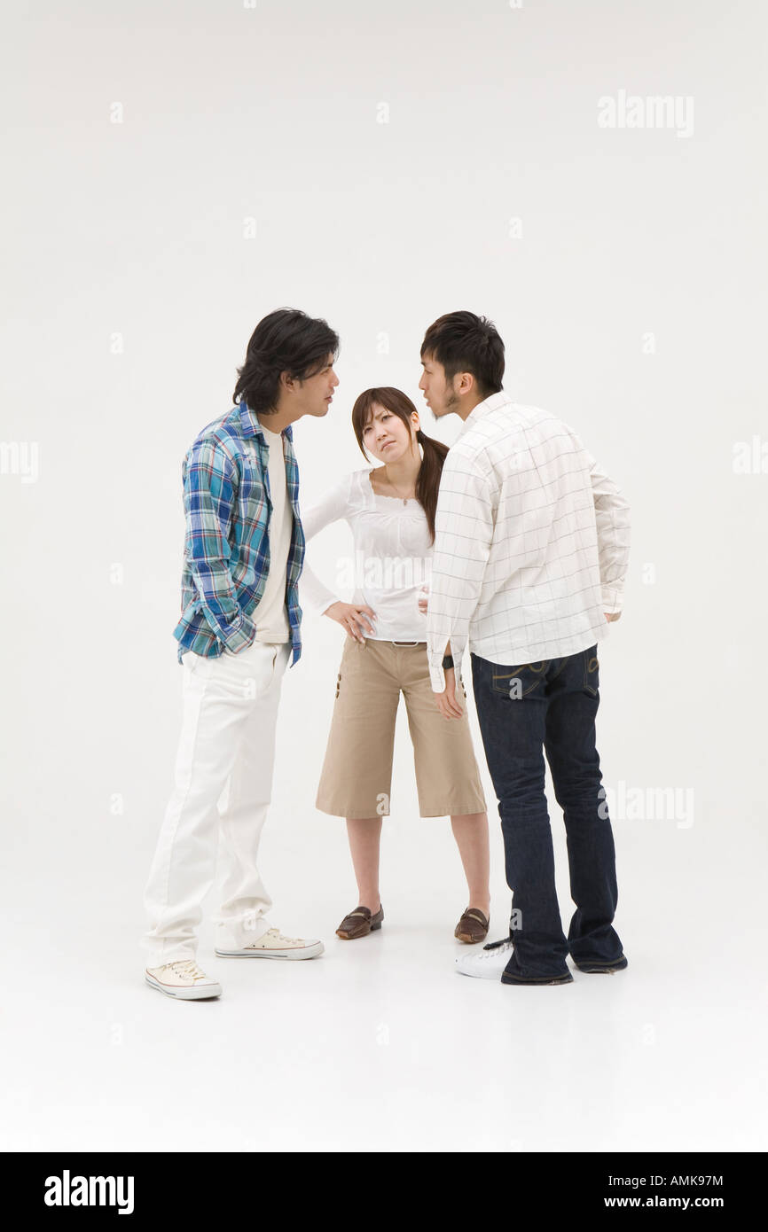 Three young people arguing Stock Photo - Alamy