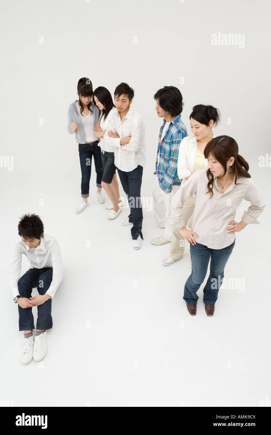 Young man excluded from group hi-res stock photography and images - Alamy