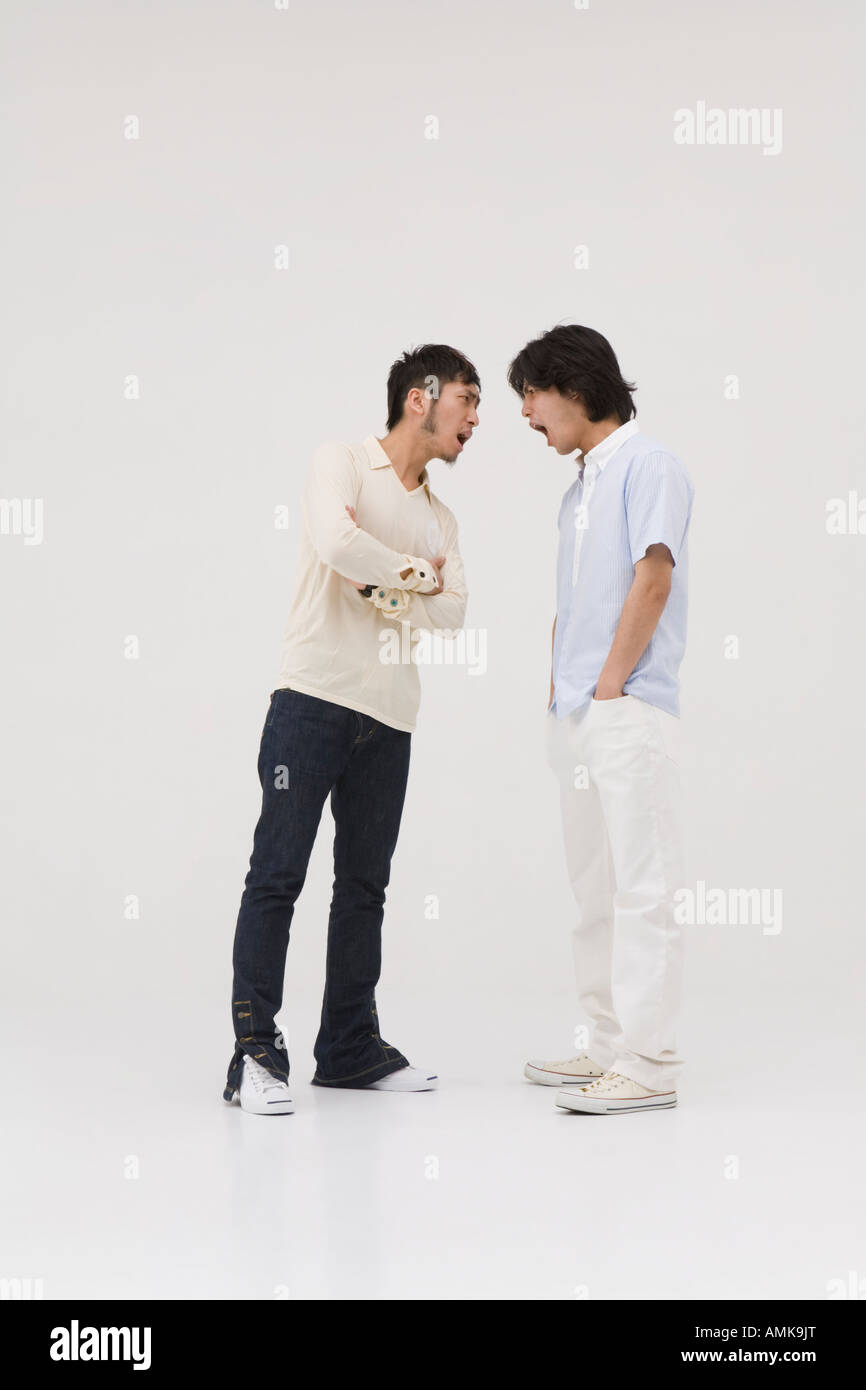 Two young men arguing Stock Photo - Alamy