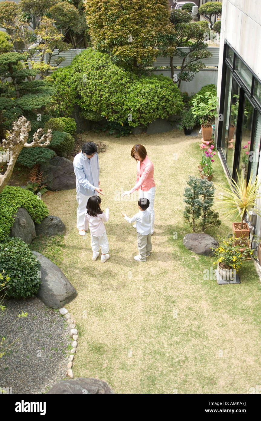 Family playing a game of rock scissors paper Stock Photo - Alamy