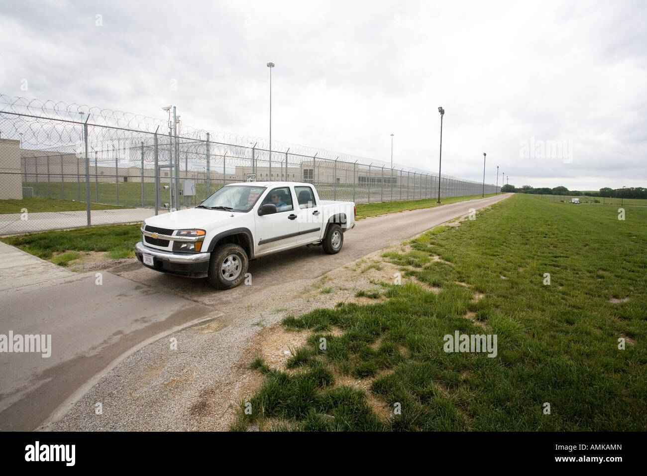 Vehicle patrolling outer perimeter fence Maximum security prison ...