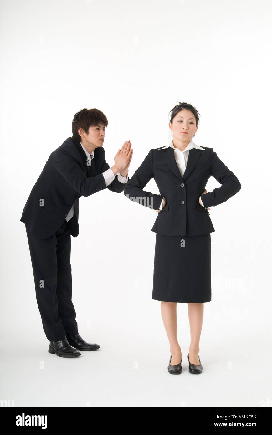 Young businessman apologizing Stock Photo - Alamy