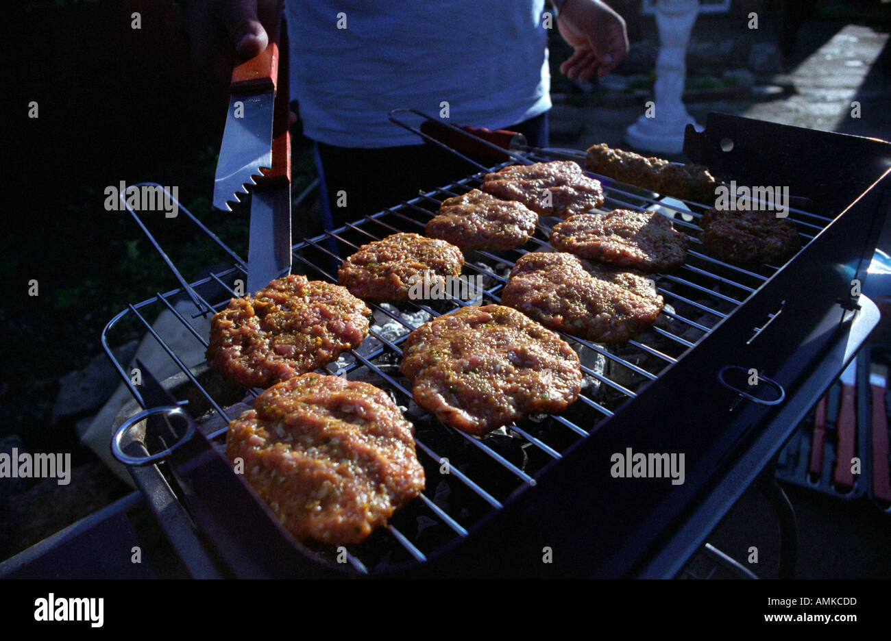 Cooking burgers flip hi-res stock photography and images - Alamy