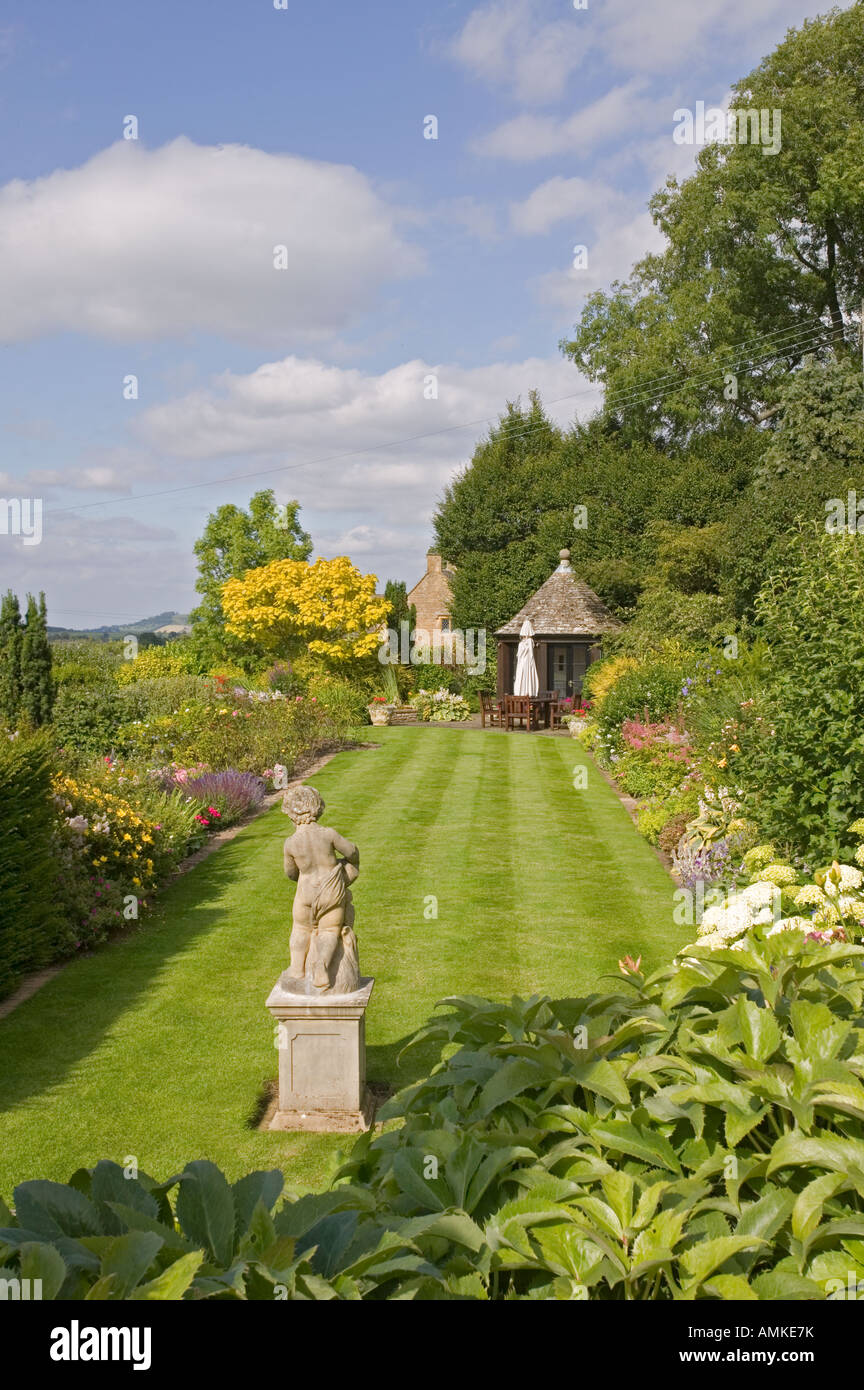 garden with statue and lawn Stock Photo - Alamy