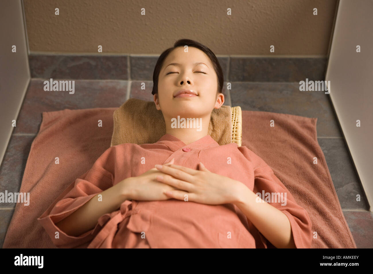 Young woman lying at bedrock bath Stock Photo - Alamy