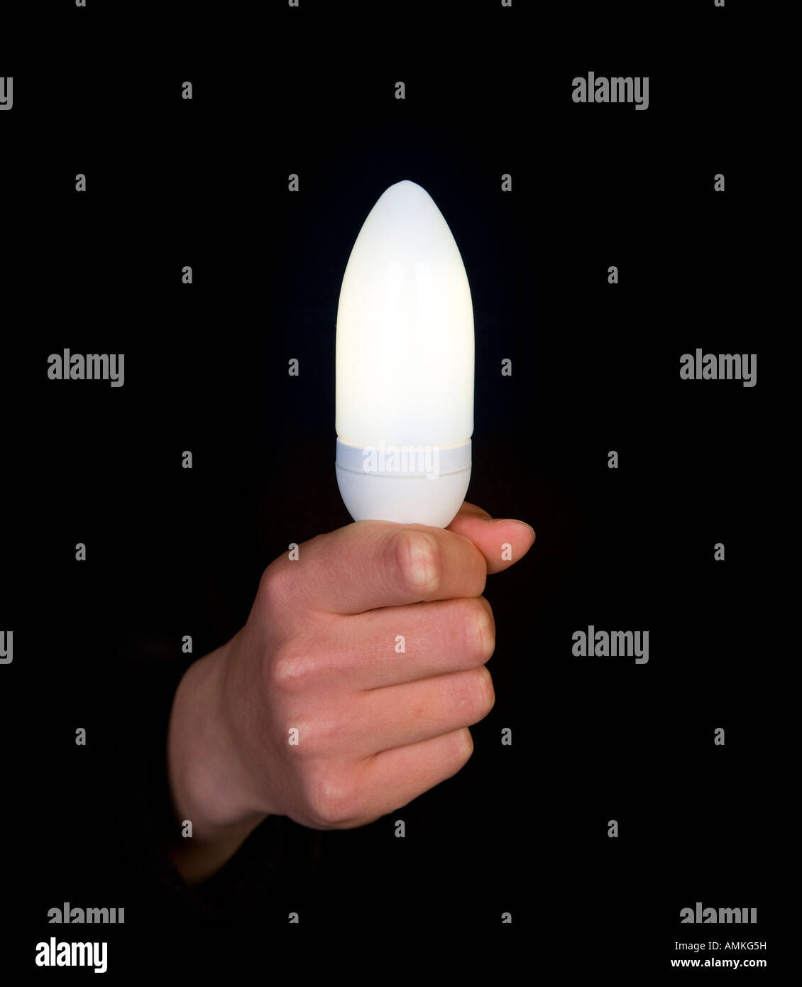 hand holding illuminated energy efficient light bulb Stock Photo - Alamy