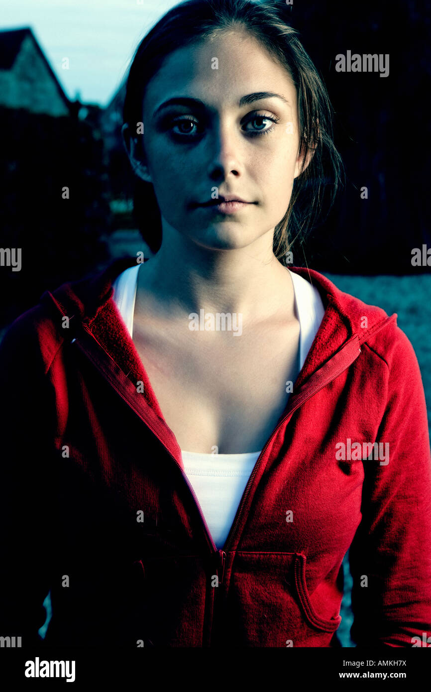 Head and shoulders portrait of a young woman wearing a red jacket Stock ...