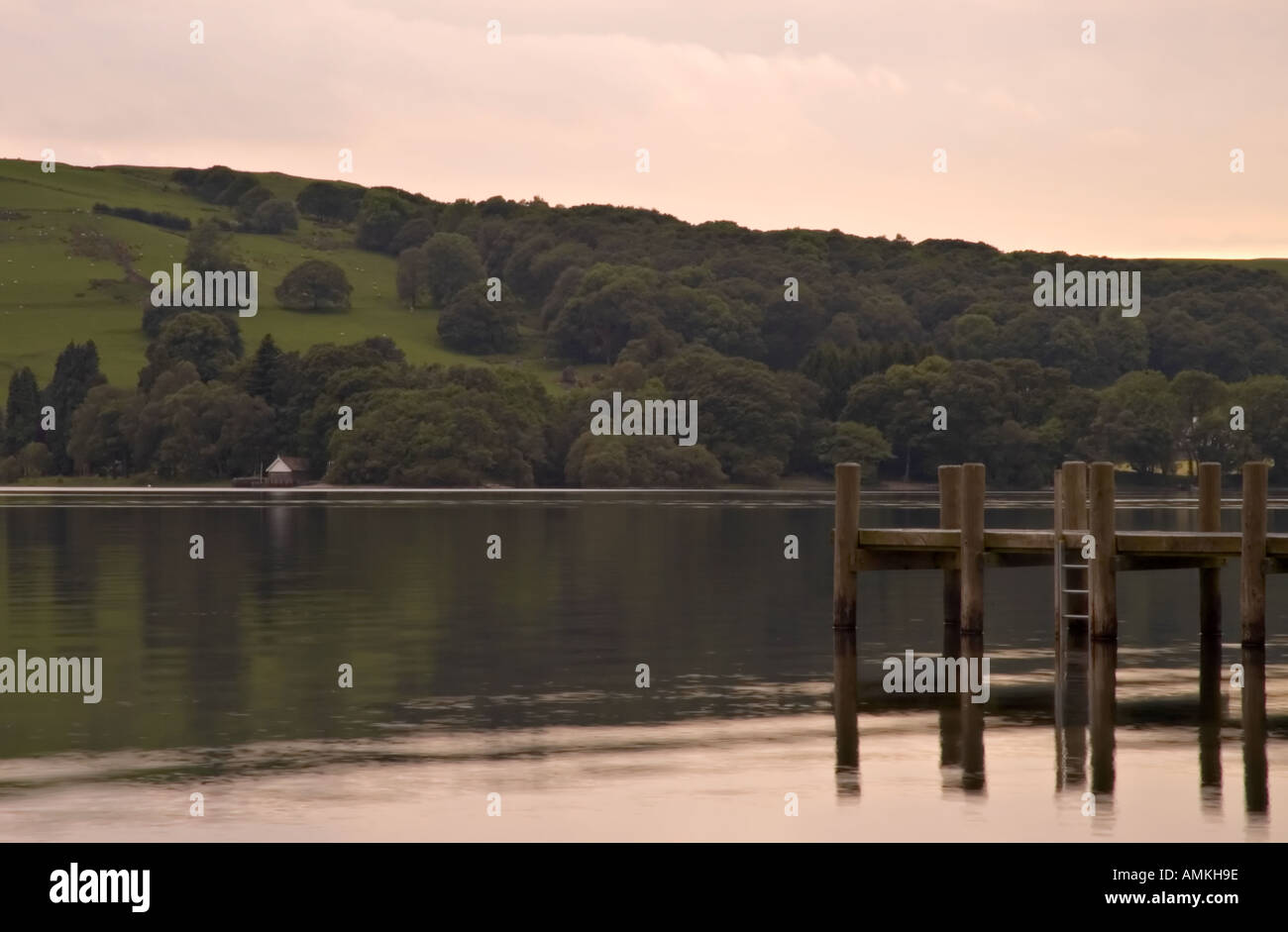 view west across coniston water towards torver pier in the lake ...