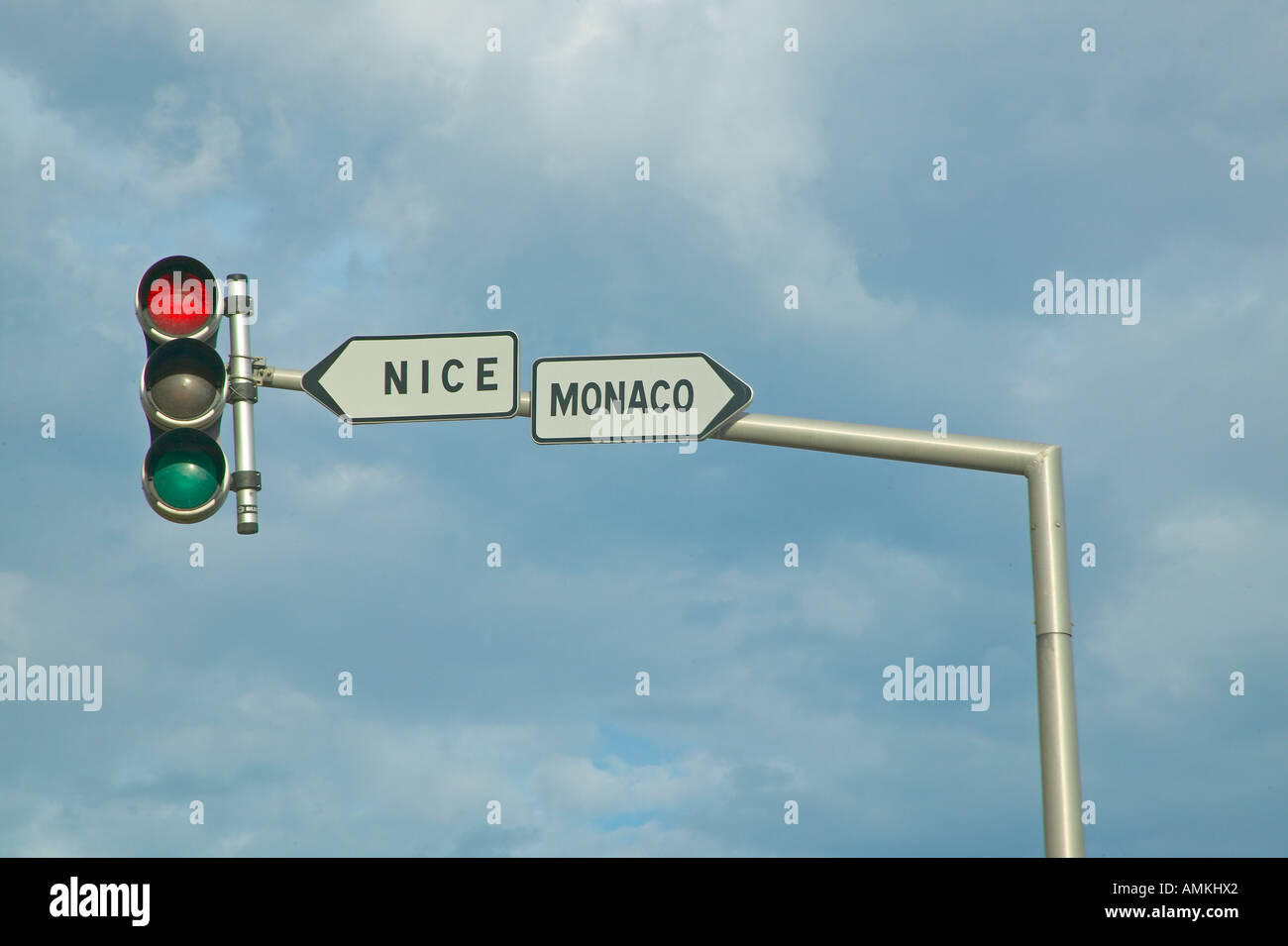 Stop light with direction sign Nice or Monaco Stock Photo - Alamy
