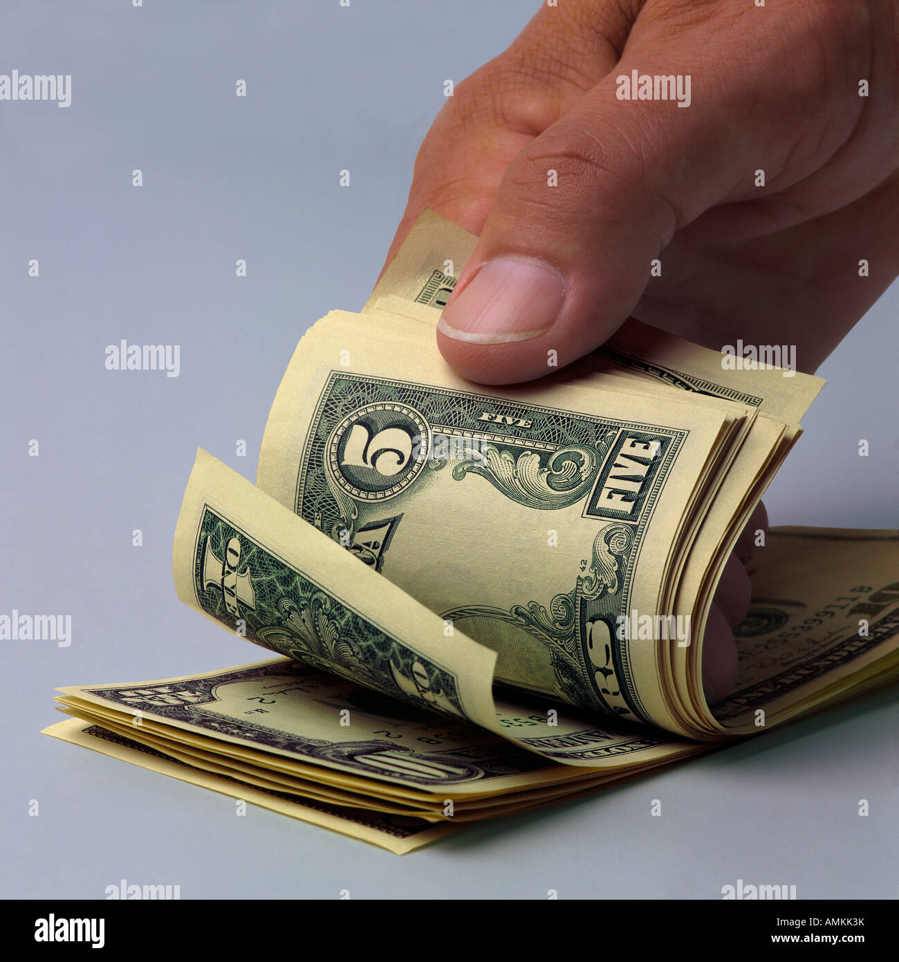Counting Dollar notes Stock Photo - Alamy