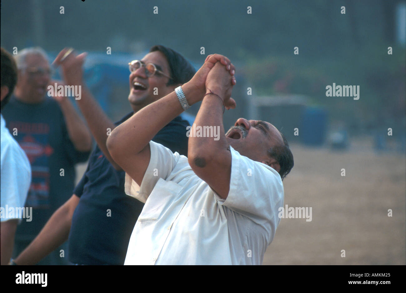 Members of Laughing Club during their laughter session at Juhu beach ...