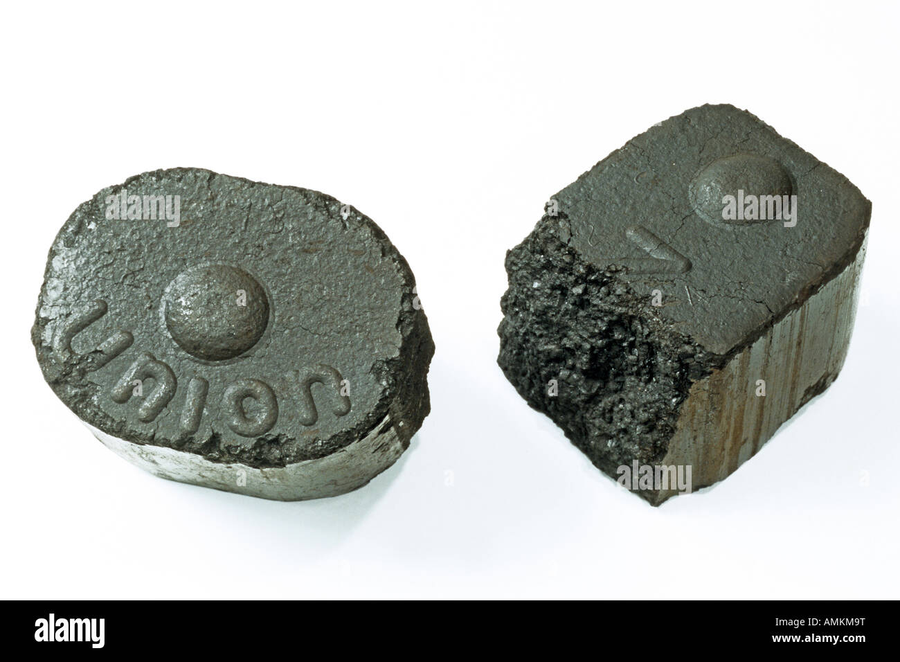 Brown coal or lignite, two bricketts, studio picture Stock Photo - Alamy