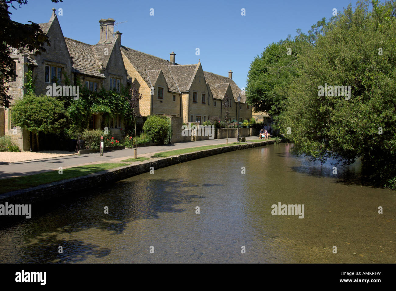 River Windrush runs through Bourton on the water Gloucestershire ...
