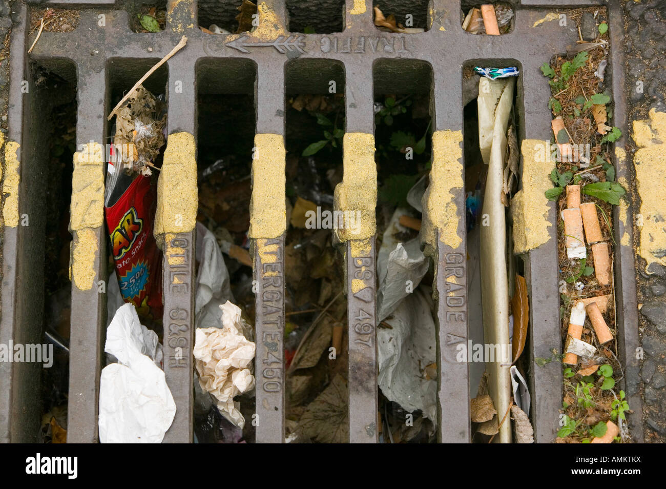 rubbish thrown down a drain Stock Photo - Alamy